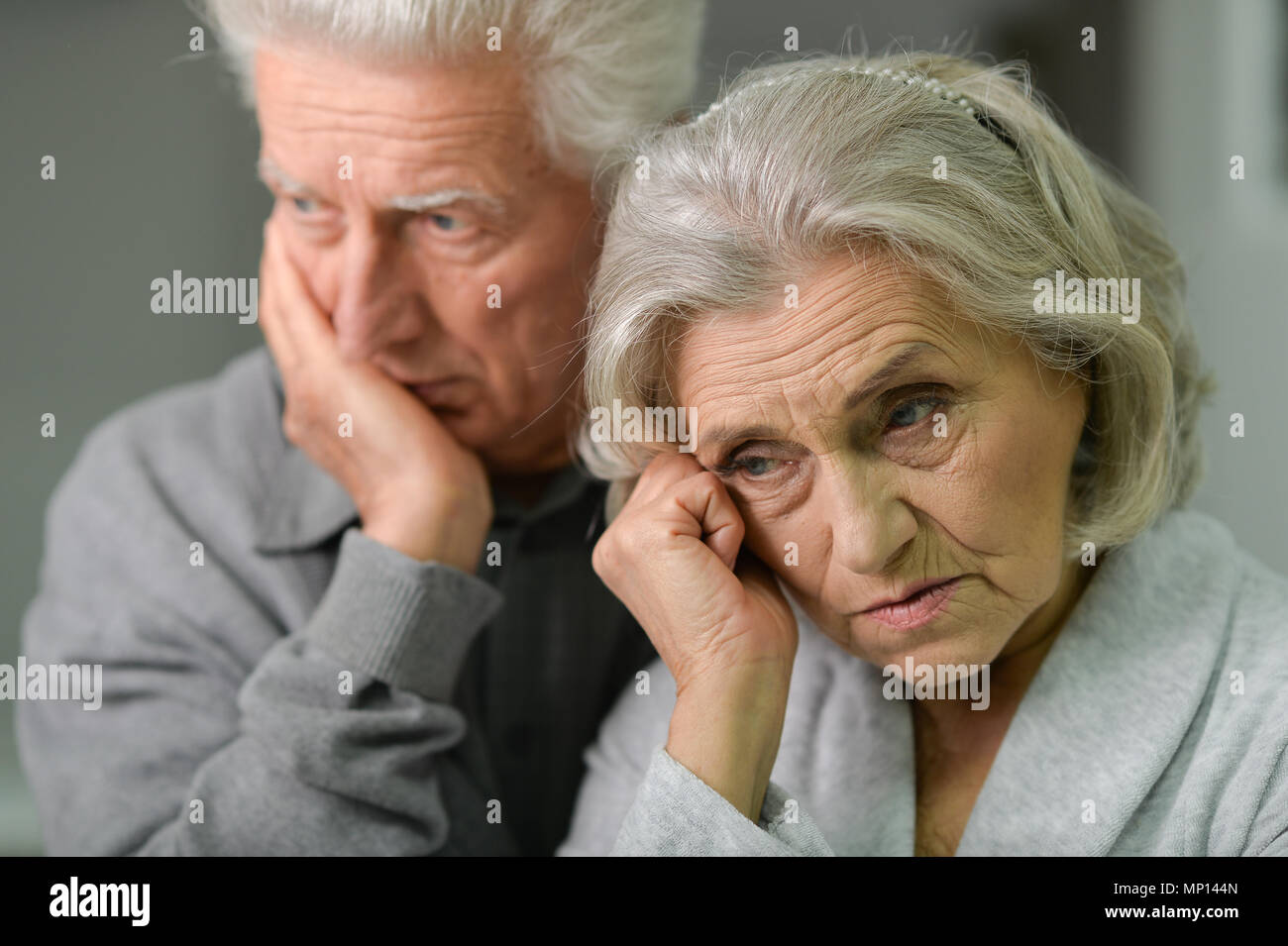 Sad senior couple Stock Photo - Alamy