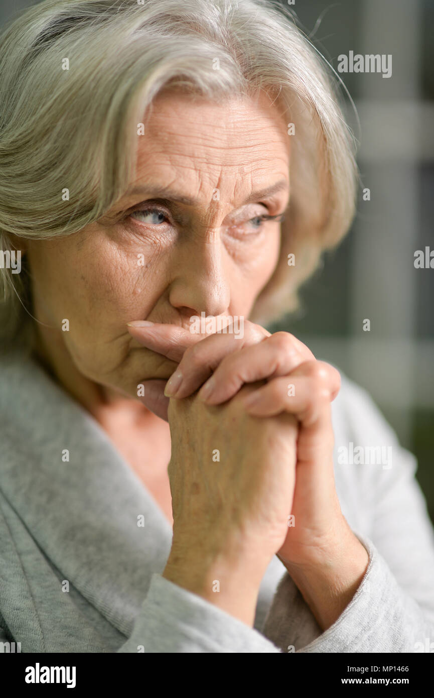 Portrait of tired senior woman Stock Photo - Alamy