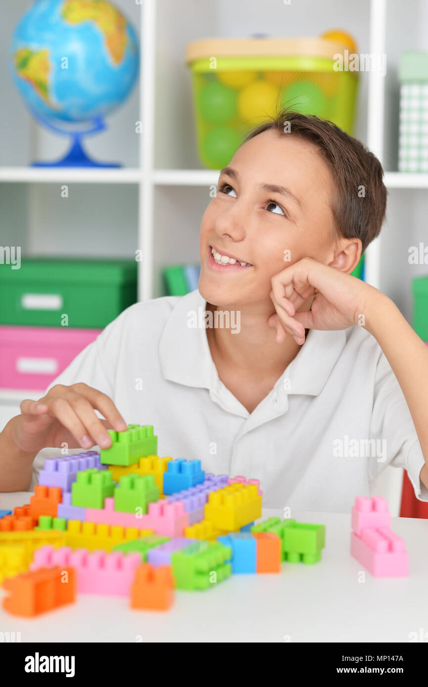 Boy playing with colorful Stock Photo - Alamy