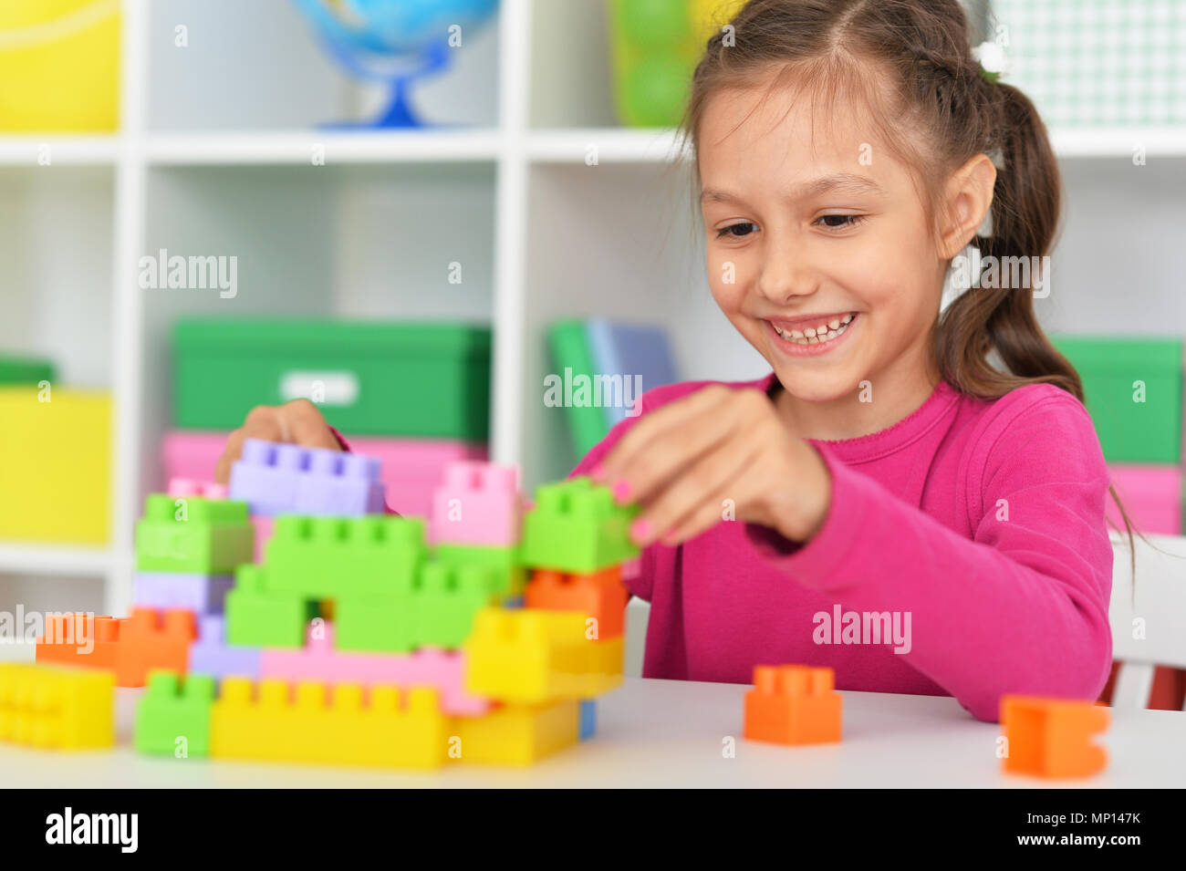 Cute girl playing Stock Photo - Alamy