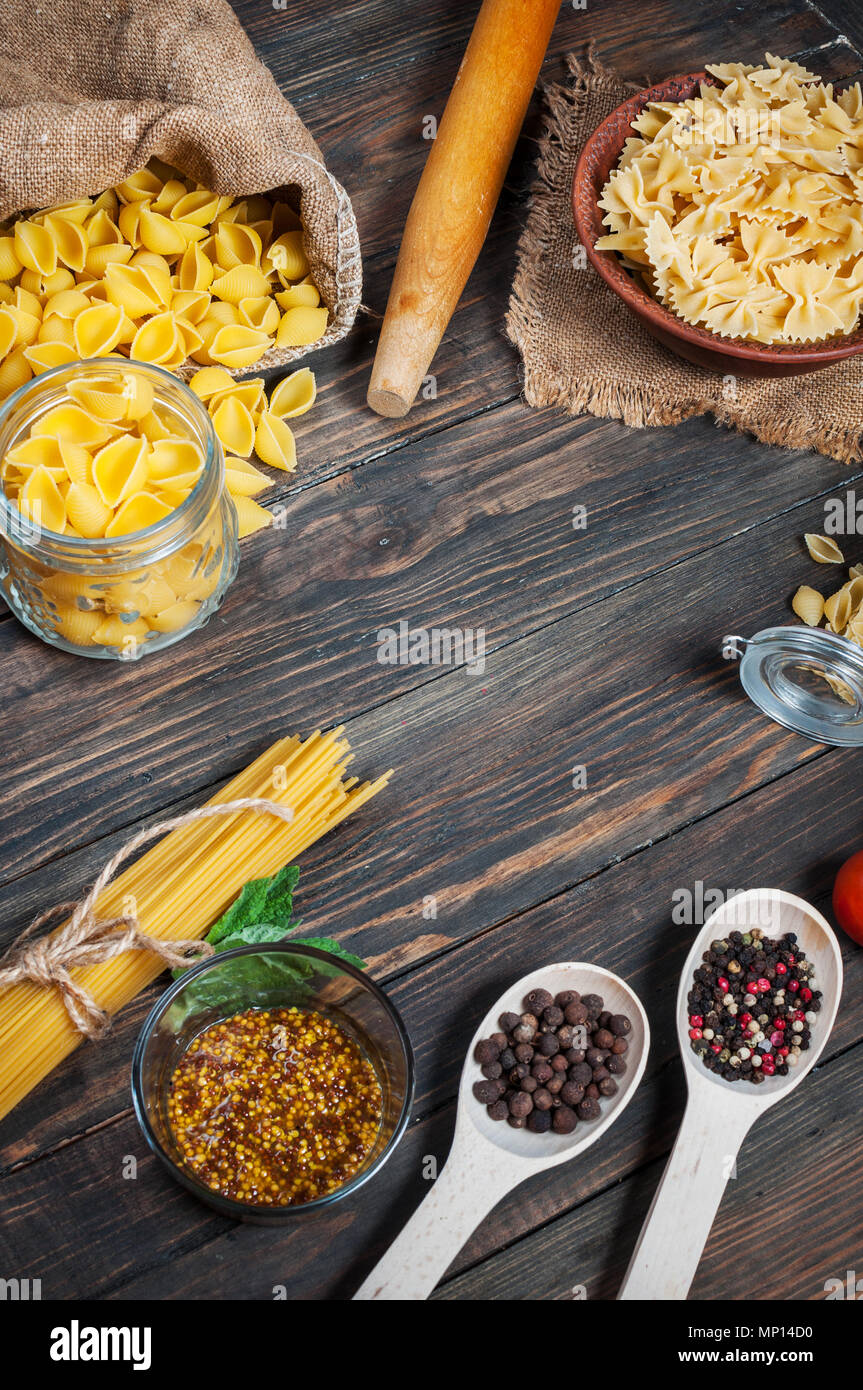 Mixed dried pasta selection on wooden background Stock Photo - Alamy