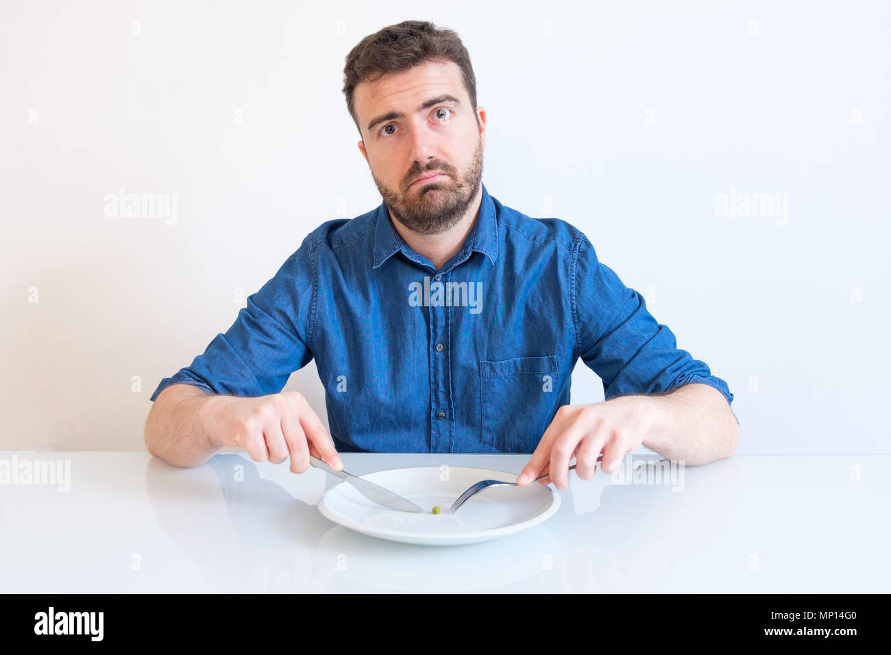 Hungry Man High Resolution Stock Photography and Images - Alamy