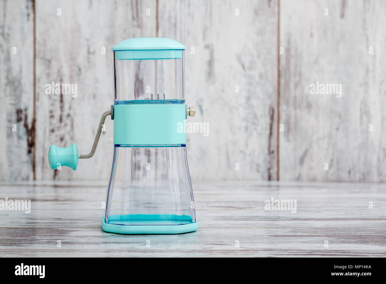 Walnut and hazel grinder mill on white wooden background Stock Photo ...