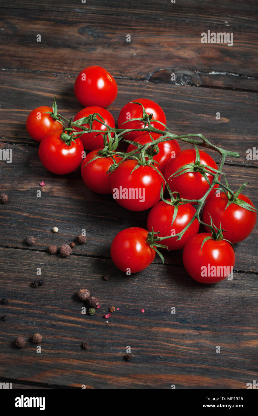 Fresh cherry tomatoes on wood background Stock Photo - Alamy