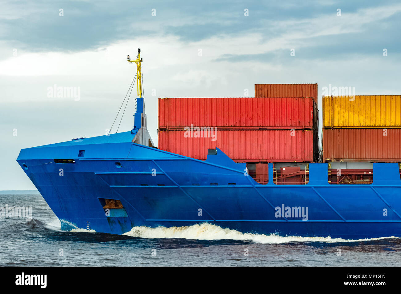 Blue cargo container ship fully loaded underway Stock Photo - Alamy