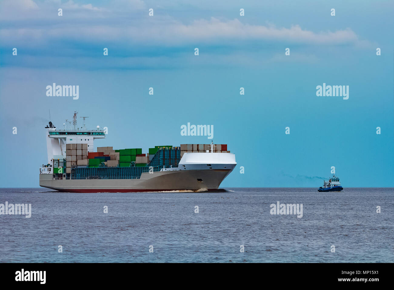 Grey container ship. Logistics and production import Stock Photo - Alamy