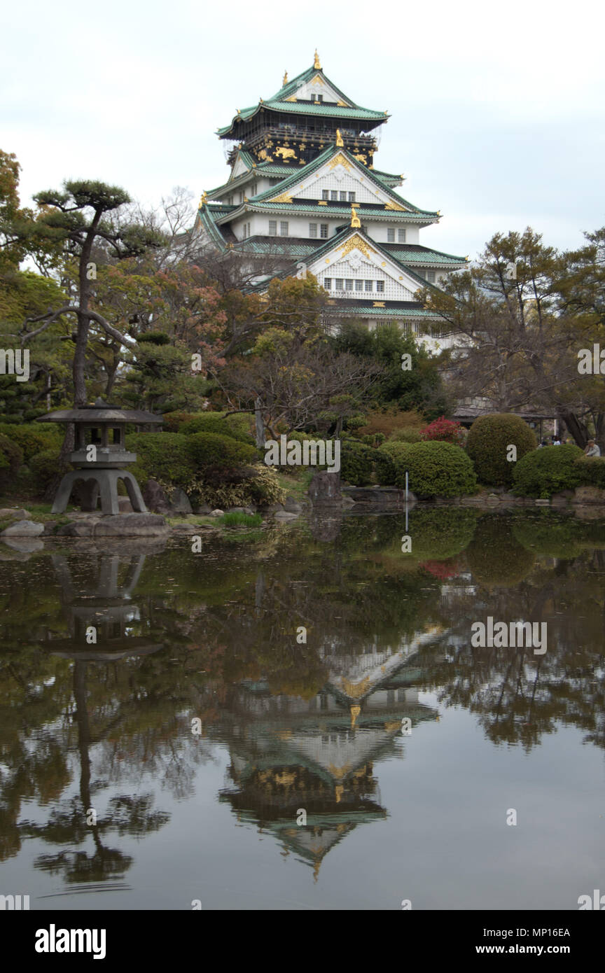Osaka castle with reflection in pond on a cloudy day, Osaka, Japan Stock Photo - Alamy