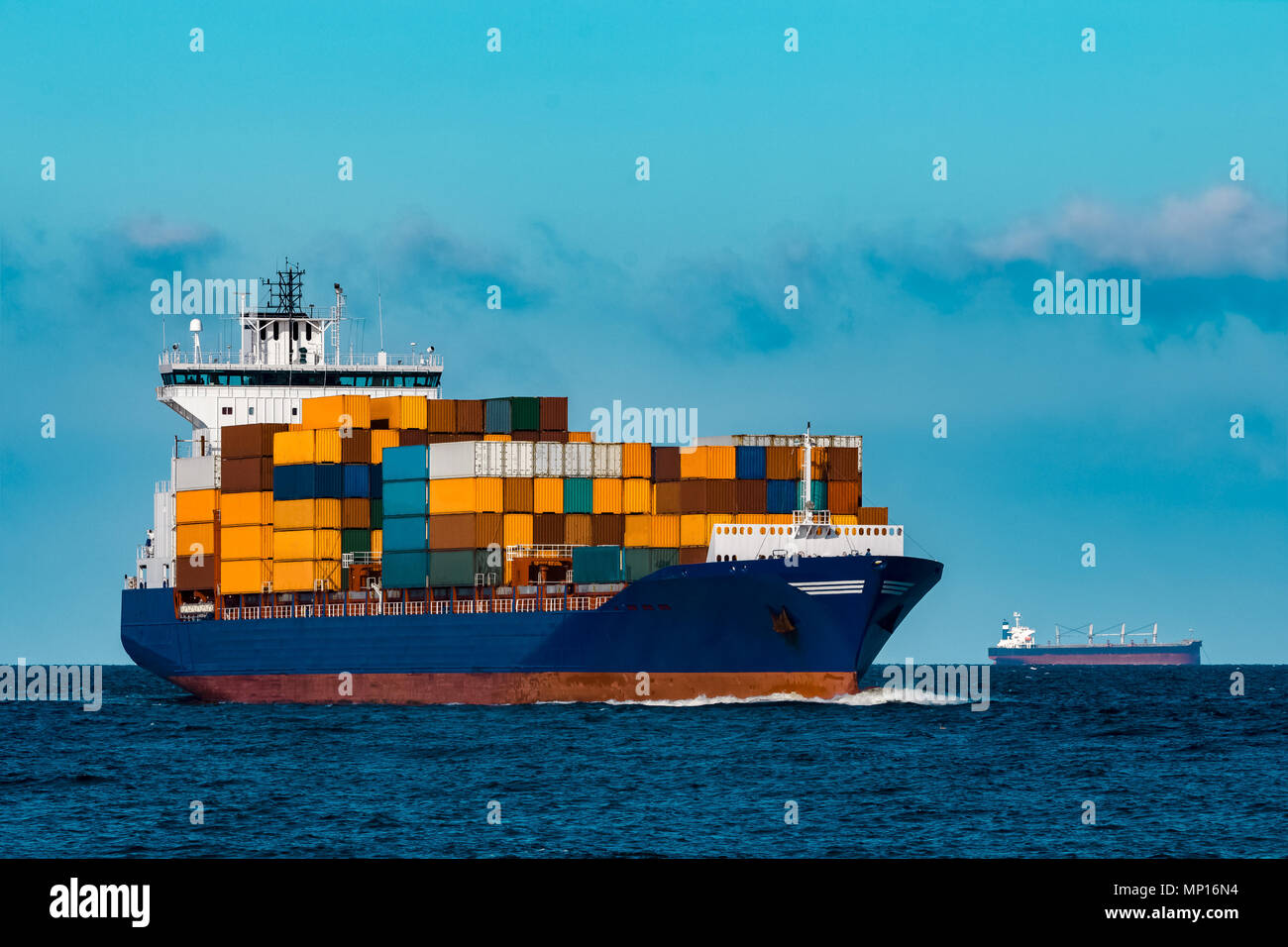 Blue container ship in travel. Logistics and freight industry Stock ...