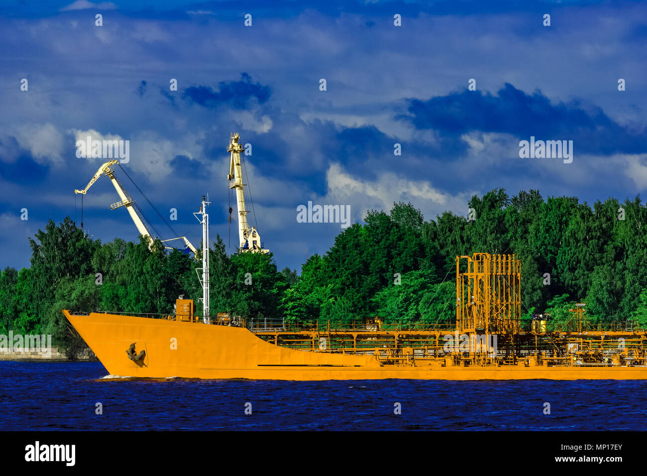 Yellow cargo tanker ship moving at the clear summer day Stock Photo - Alamy