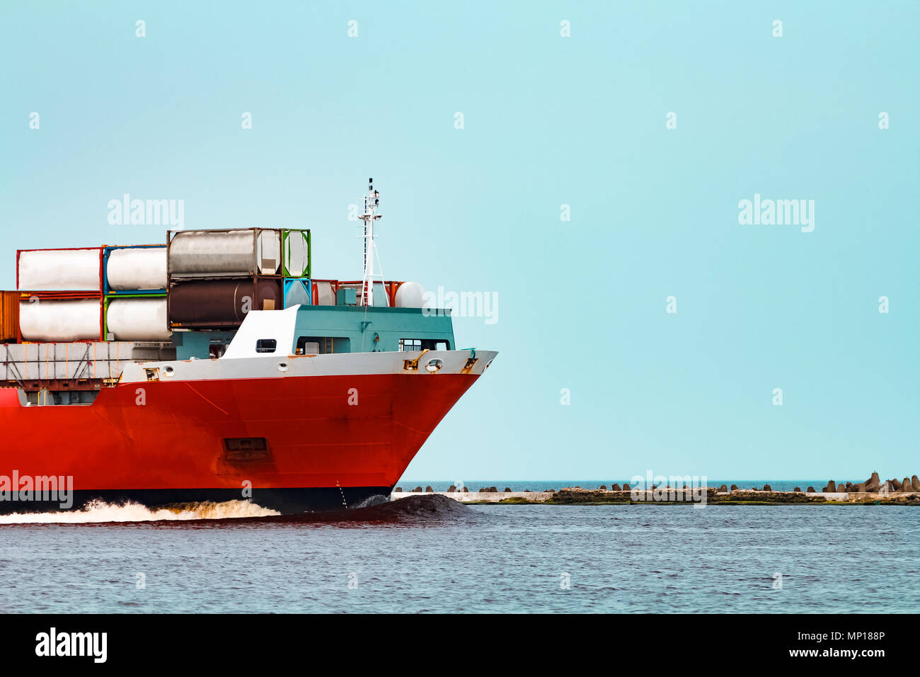 Red container ship. Logistics and production export Stock Photo - Alamy