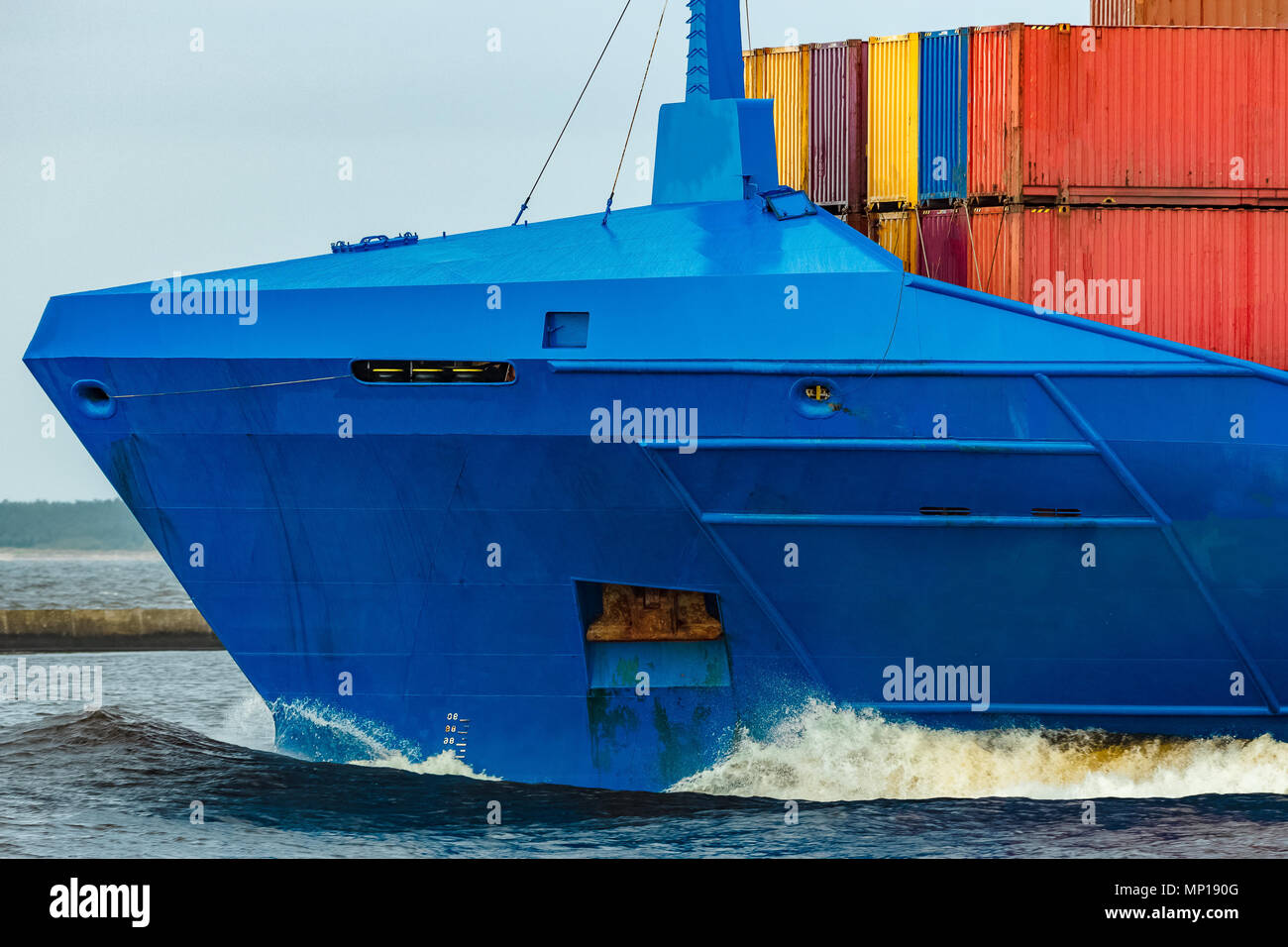 Blue cargo container ship fully loaded underway Stock Photo - Alamy