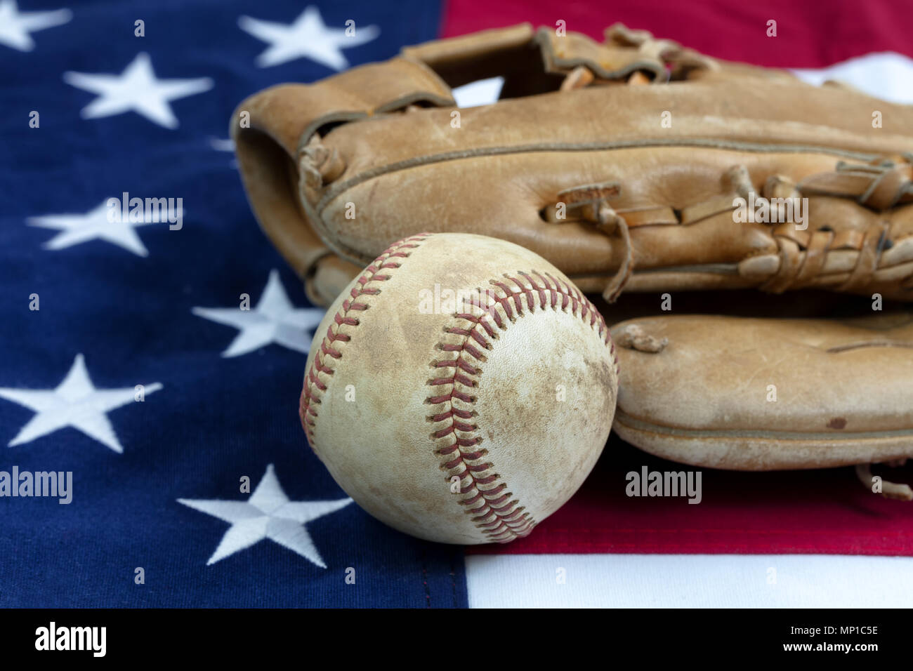 Baseball and mitt with United States flag in background Stock Photo - Alamy