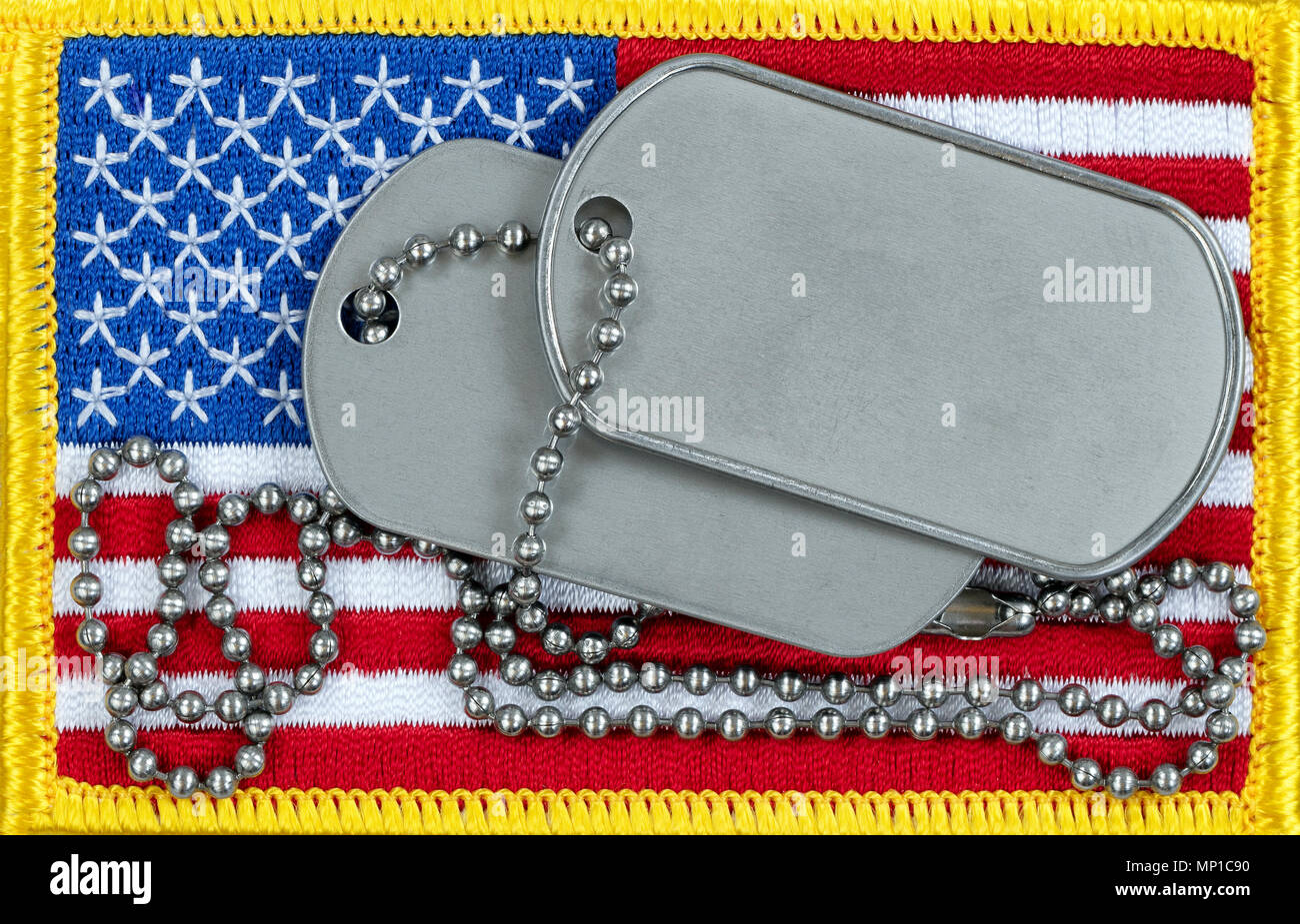 Memorial or Veterans day background with United States flag and ID tags ...