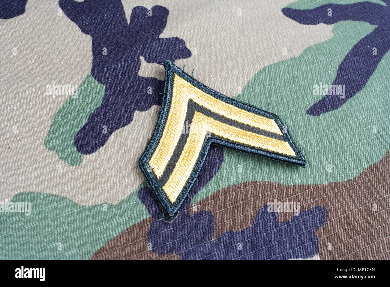 KIEV, UKRAINE - June 6, 2015. US ARMY Corporal rank patch on woodland ...