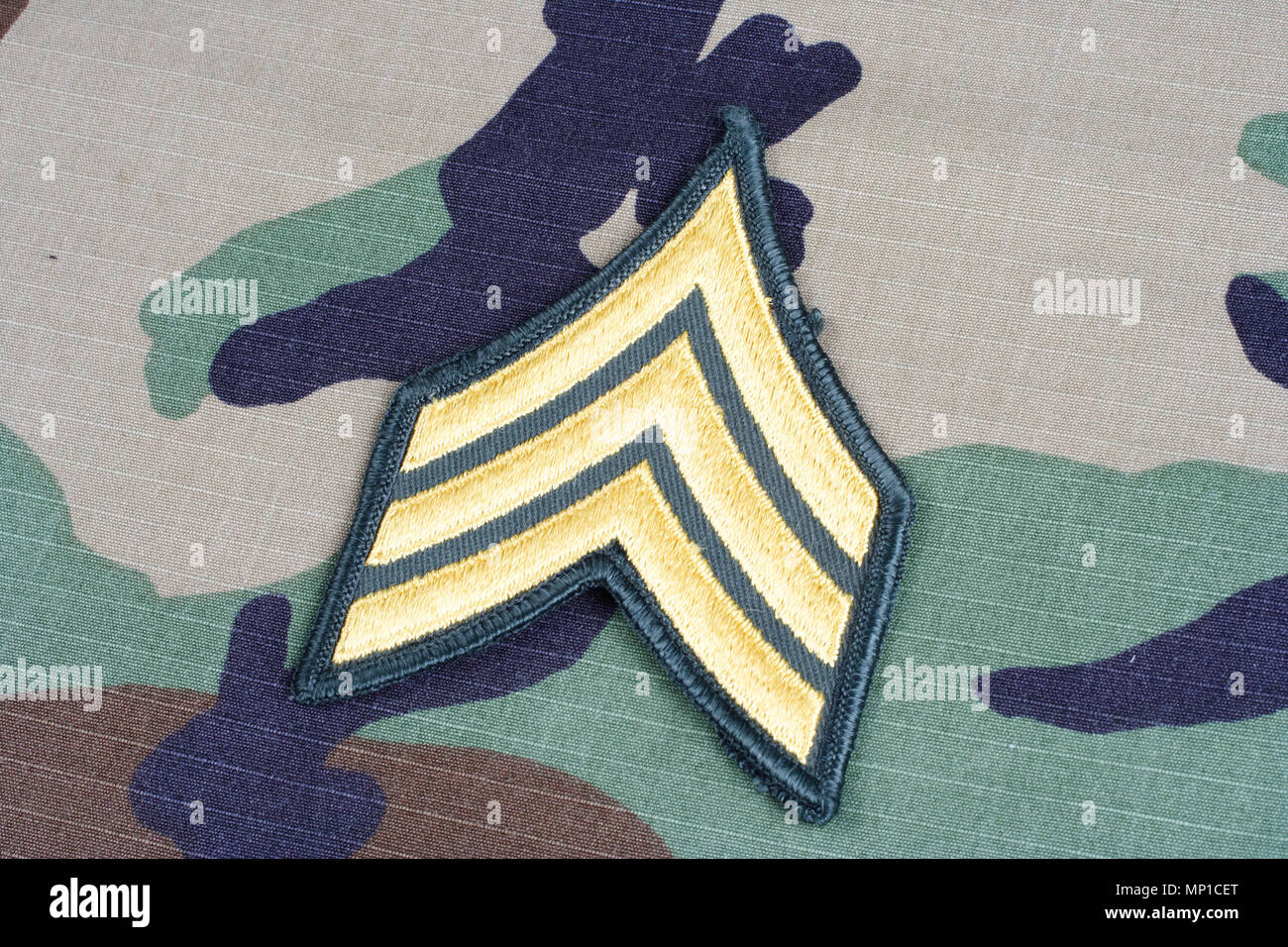 KIEV, UKRAINE - June 6, 2015. US ARMY Sergeant rank patch on woodland ...