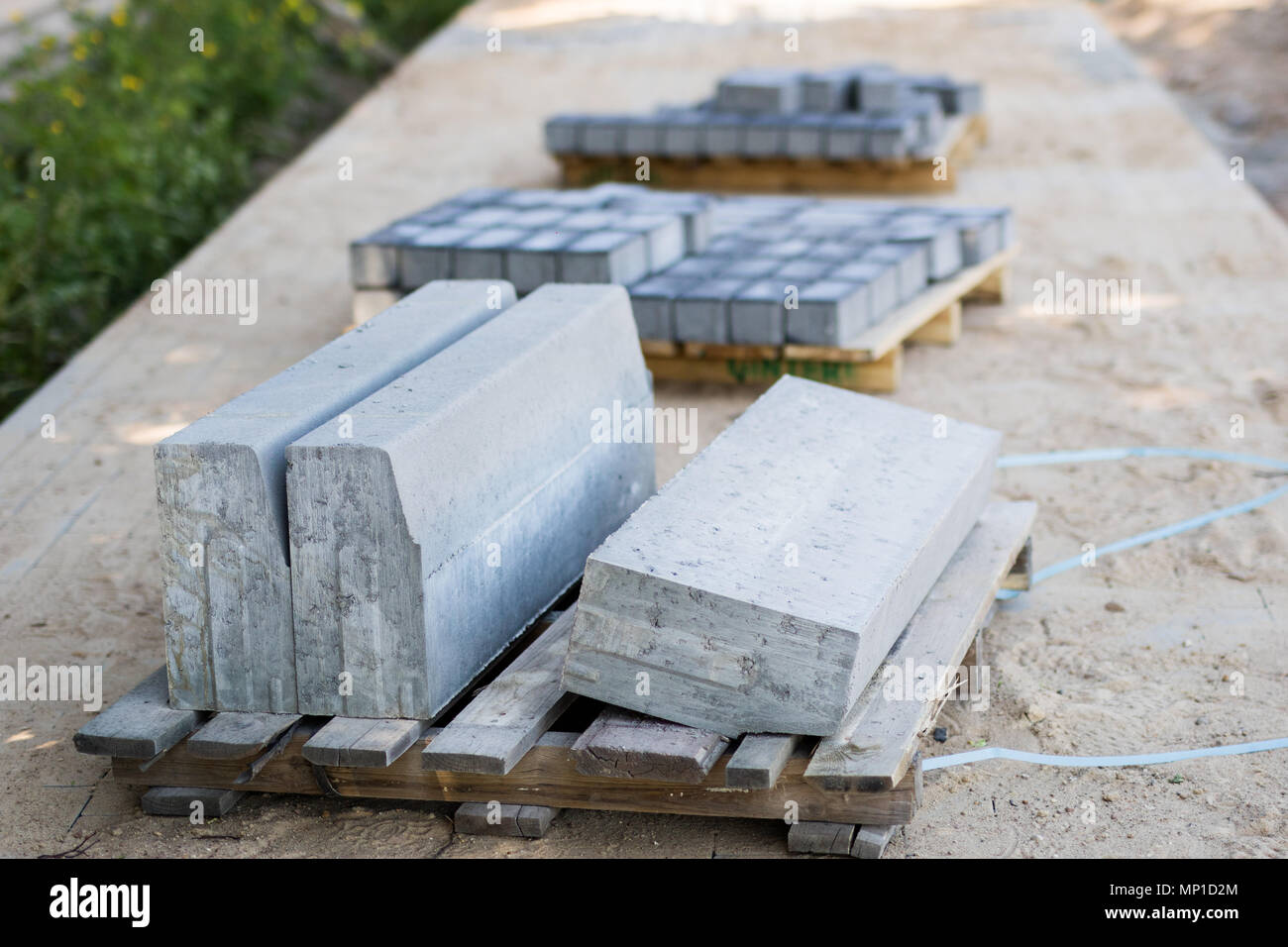 Construction site for a new road for cars. Laying paving blocks, new ...