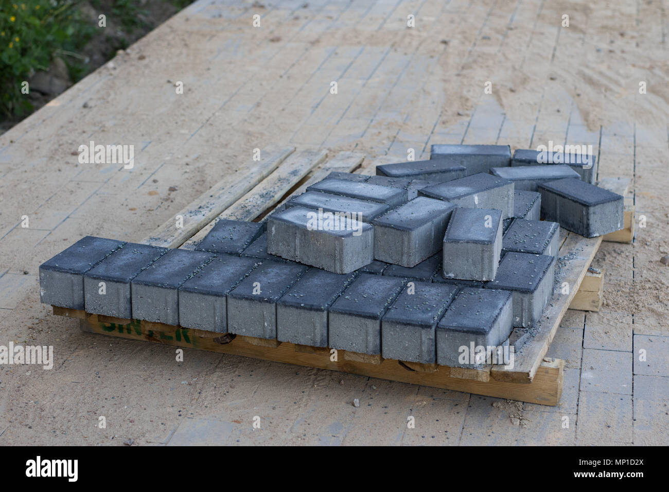 Construction site for a new road for cars. Laying paving blocks, new ...