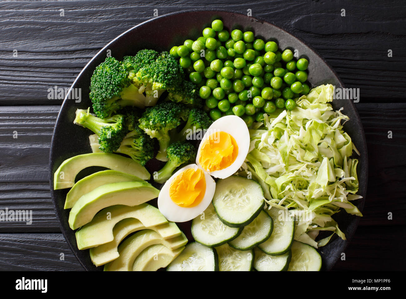 Healthy green food: fresh vegetables avocado, peas, cabbage, cucumber ...