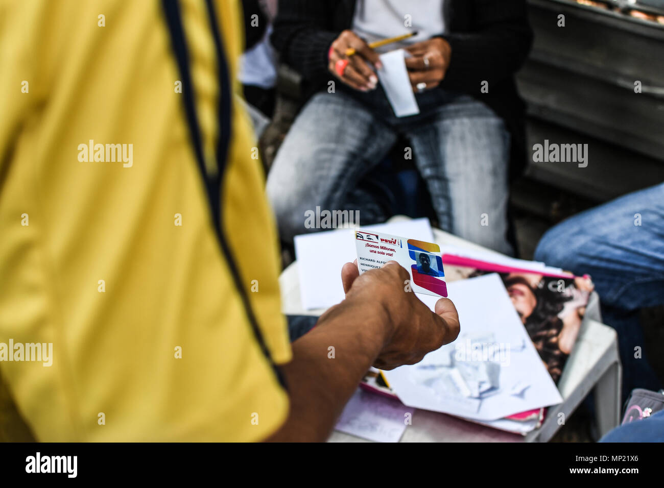 Caracas, Venezuela. 20th May 2018. A voter seen showing his ID card at ...