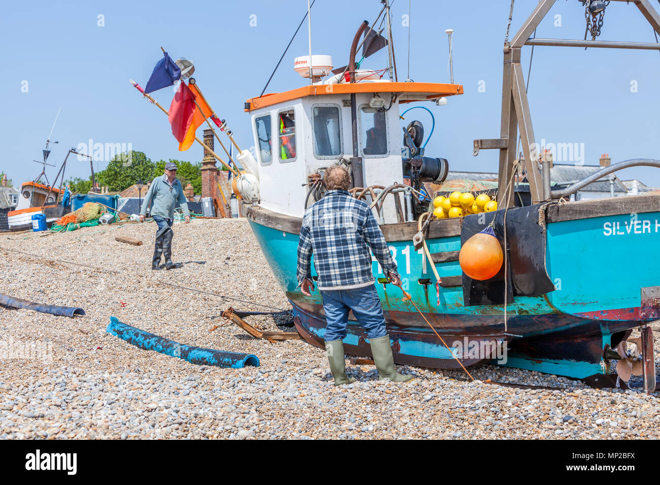 fishing trawler crew landing boat on suffolk coast Stock Photo - Alamy