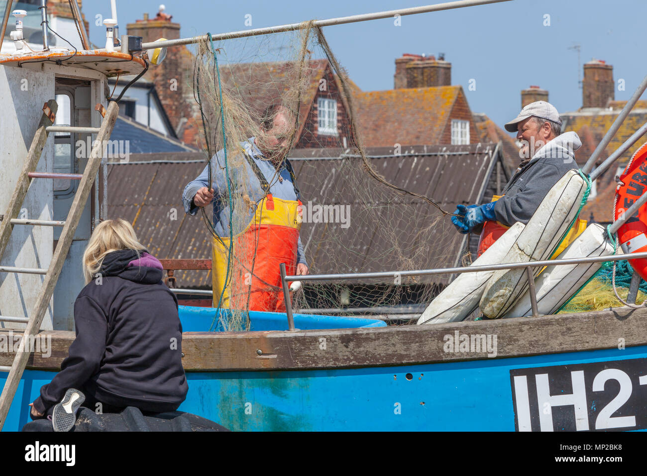 Commercial fisherman mending nets hi-res stock photography and images ...