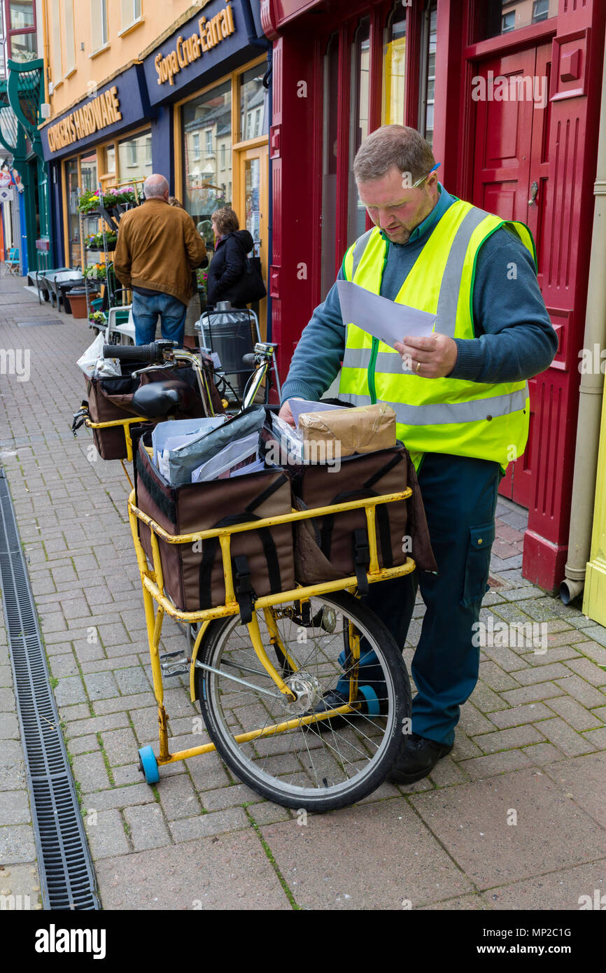 Irish Post Office, An Post, Postman with letter and parcel carrying ...