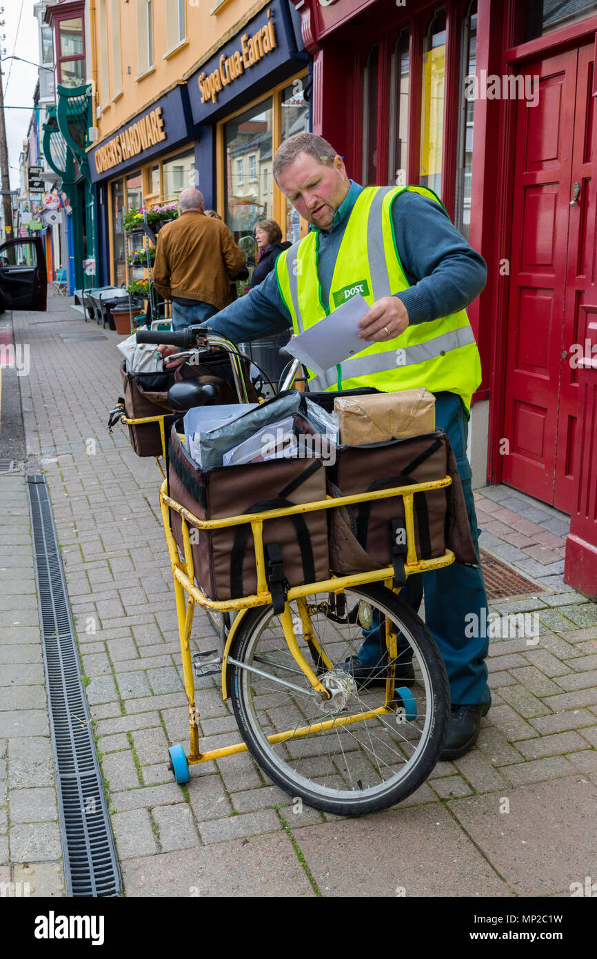 Irish Post Office, An Post, Postman with letter and parcel carrying ...