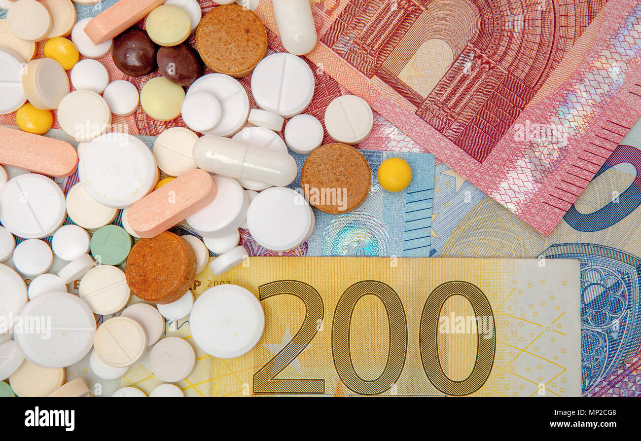 Money and pills. Pills of different colors on money. medicine concept ...