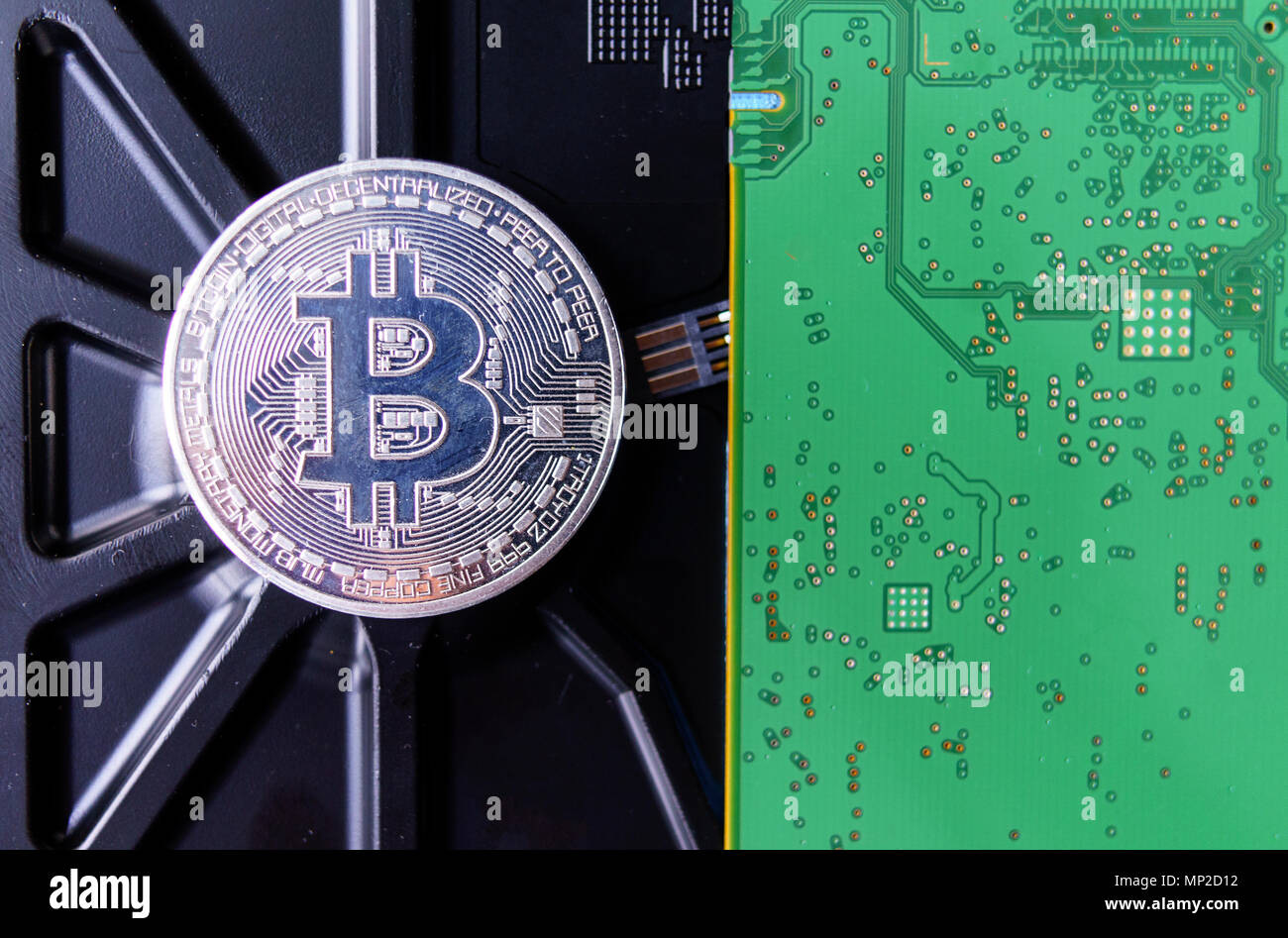 Silver souvenir coin Bitcoin on computer circuit board background Stock ...
