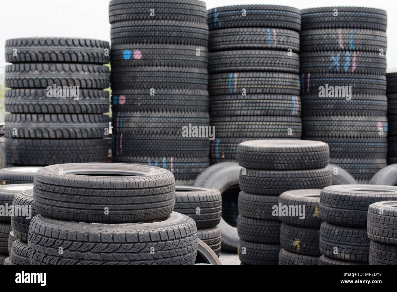 Car tires. Used old car tires at warehouse Stock Photo - Alamy