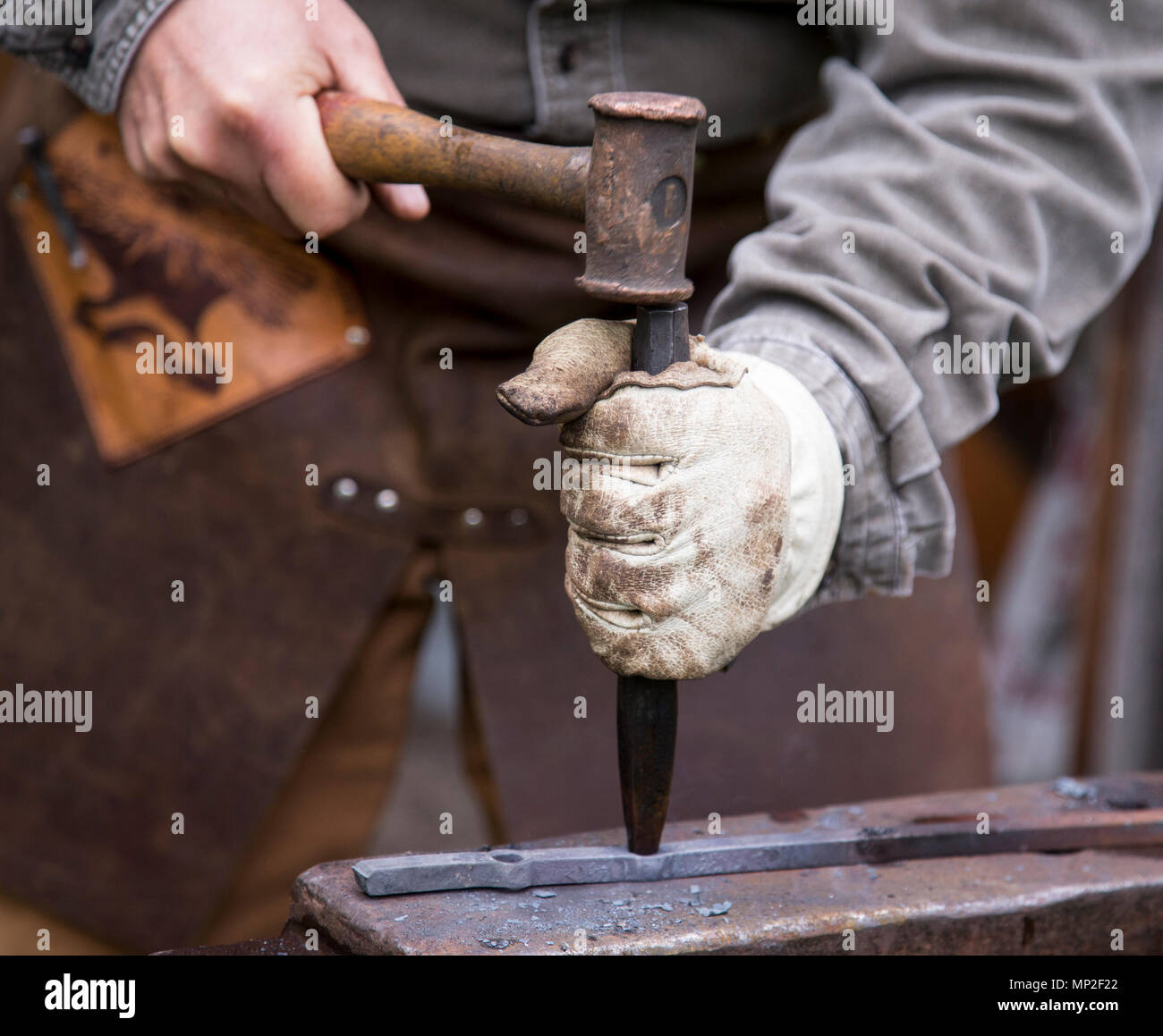 A blacksmith working at the Hopper-Goetschius House and museum in Upper ...