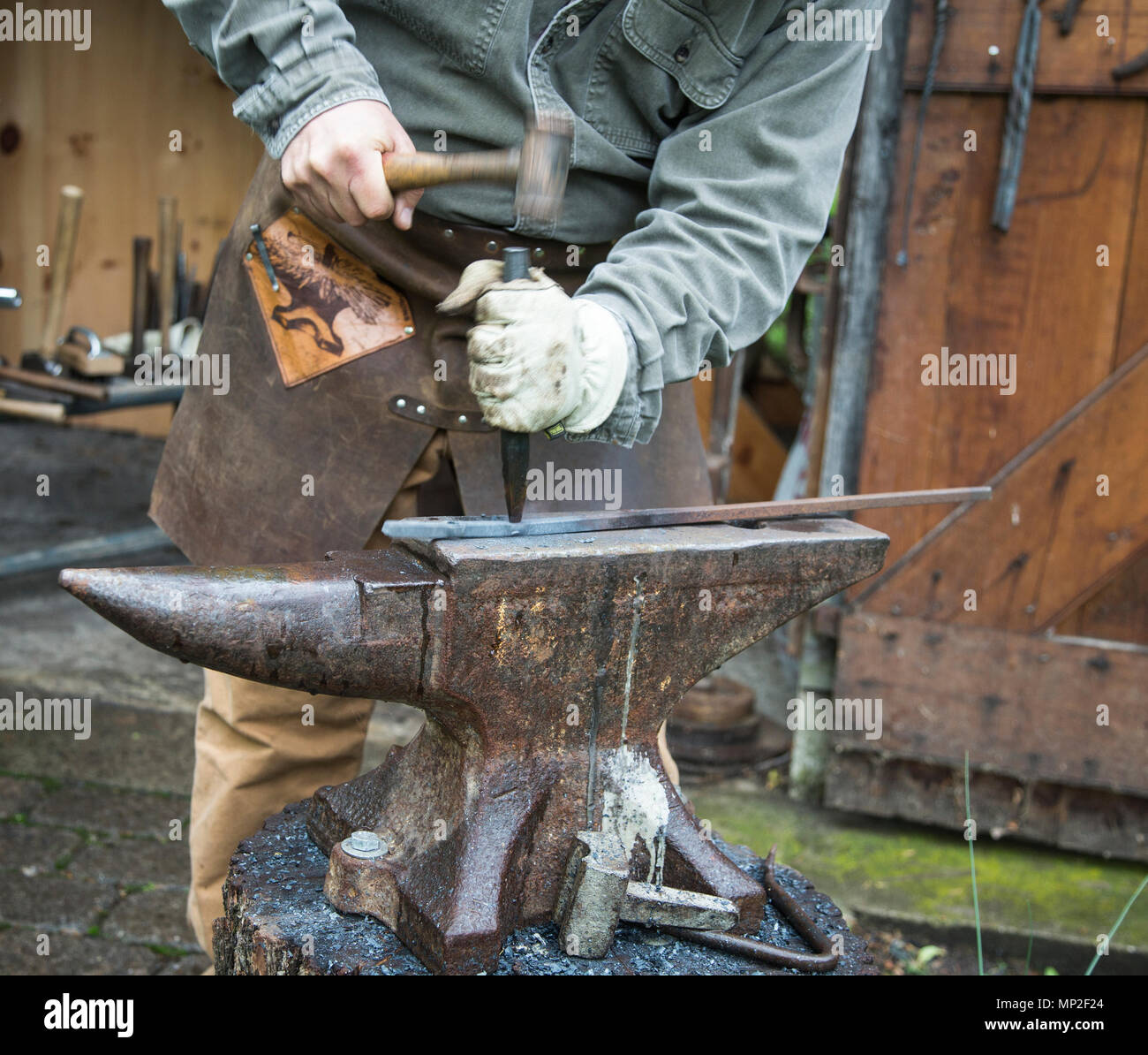 A blacksmith working at the Hopper-Goetschius House and museum in Upper ...