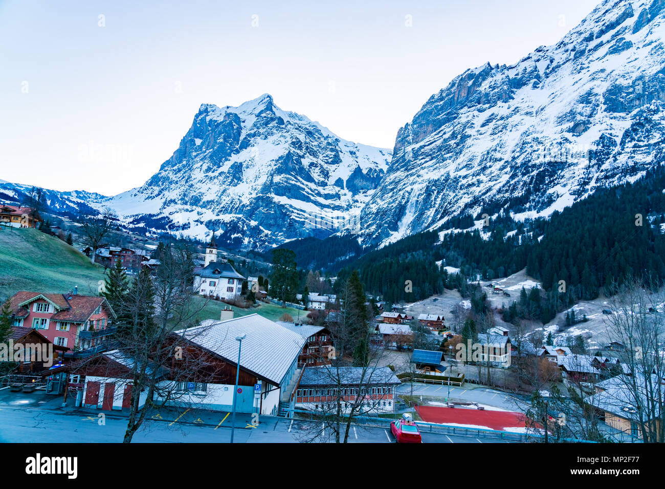 View of Grindelwald Village in the snowy valley of the Alps mountain in ...