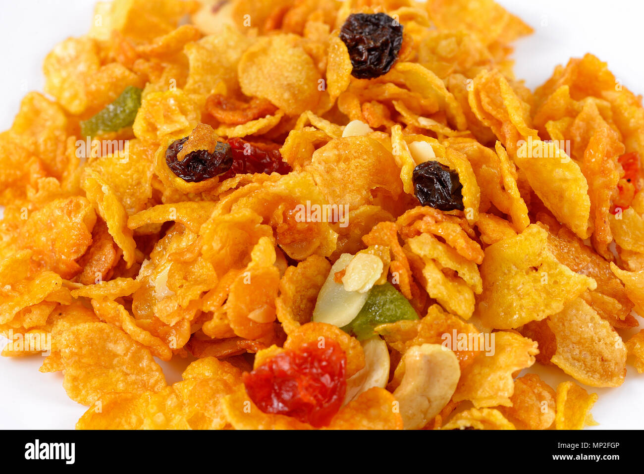Healthy corn flakes mixed with dried cranberries and black raisins ...