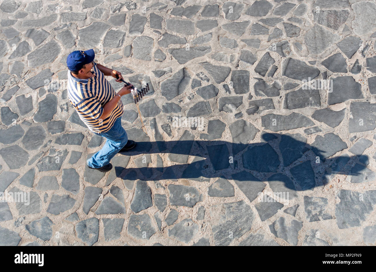 Man holding fireworks rocket in a parade in San Miguel de Allende ...