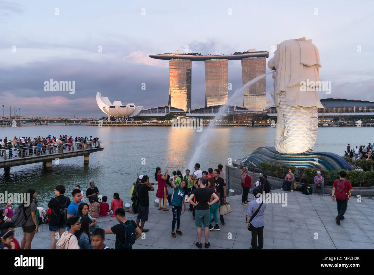 Singapore - May 13 2018: A large crowd of tourists take pictures and ...