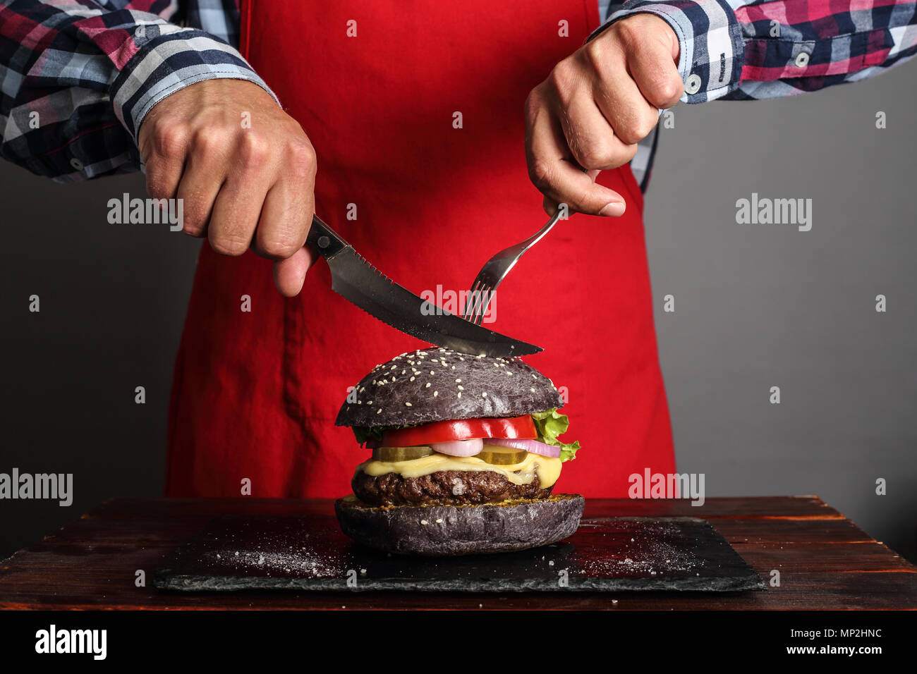 Man holding large hamburger hi-res stock photography and images - Alamy