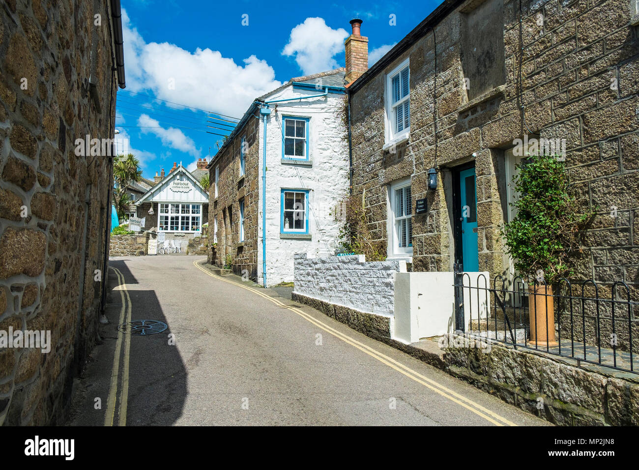 A quaint narrow street in Mousehole Village in Cornwall Stock Photo - Alamy