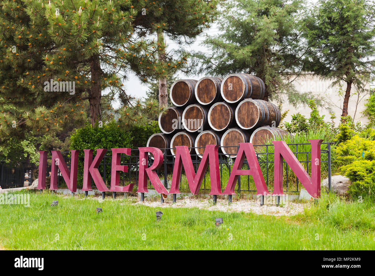 Inkerman, Crimea - May 7, 2018: Wooden wine barrels and the name of ...