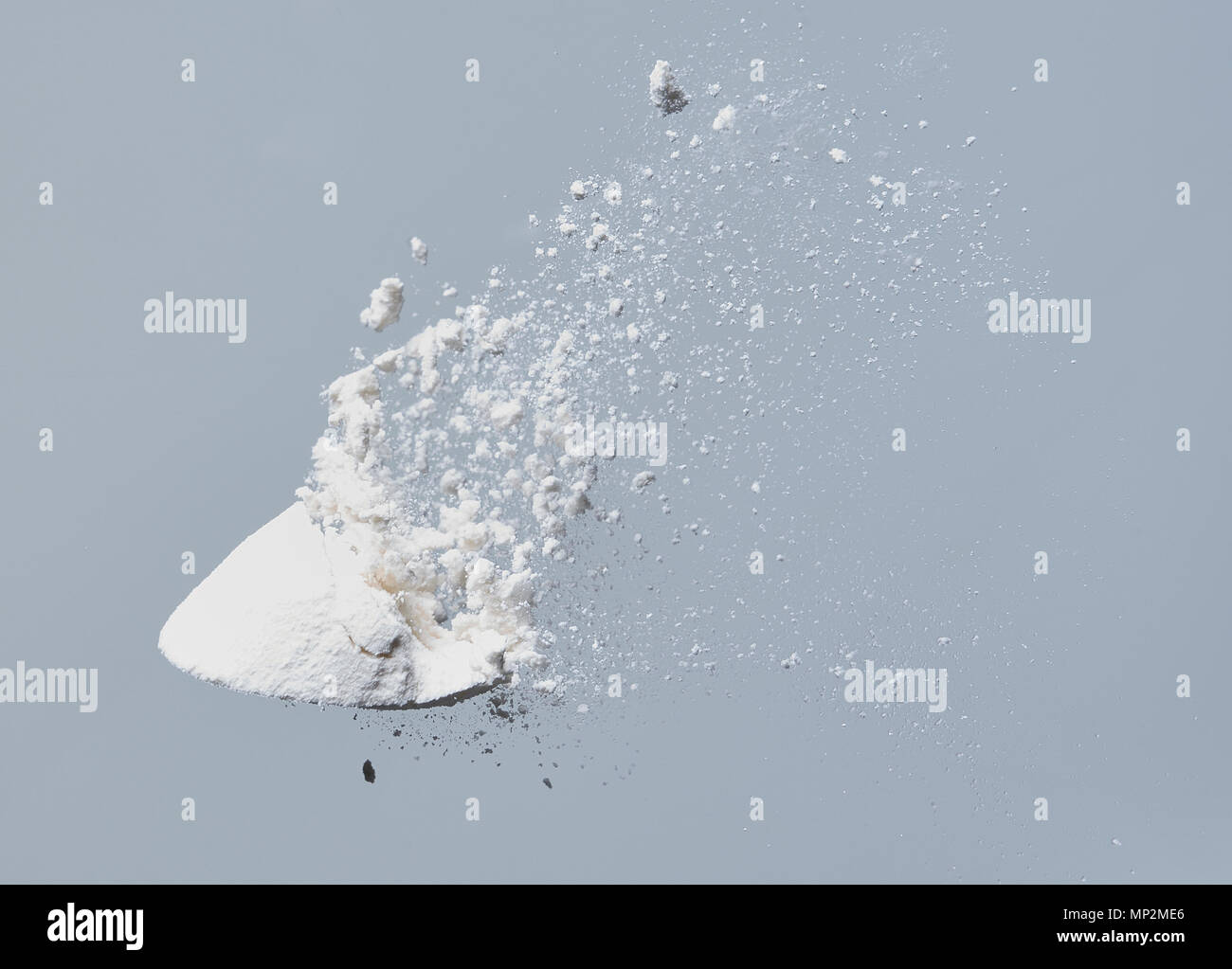 white powder flying on white background Stock Photo - Alamy