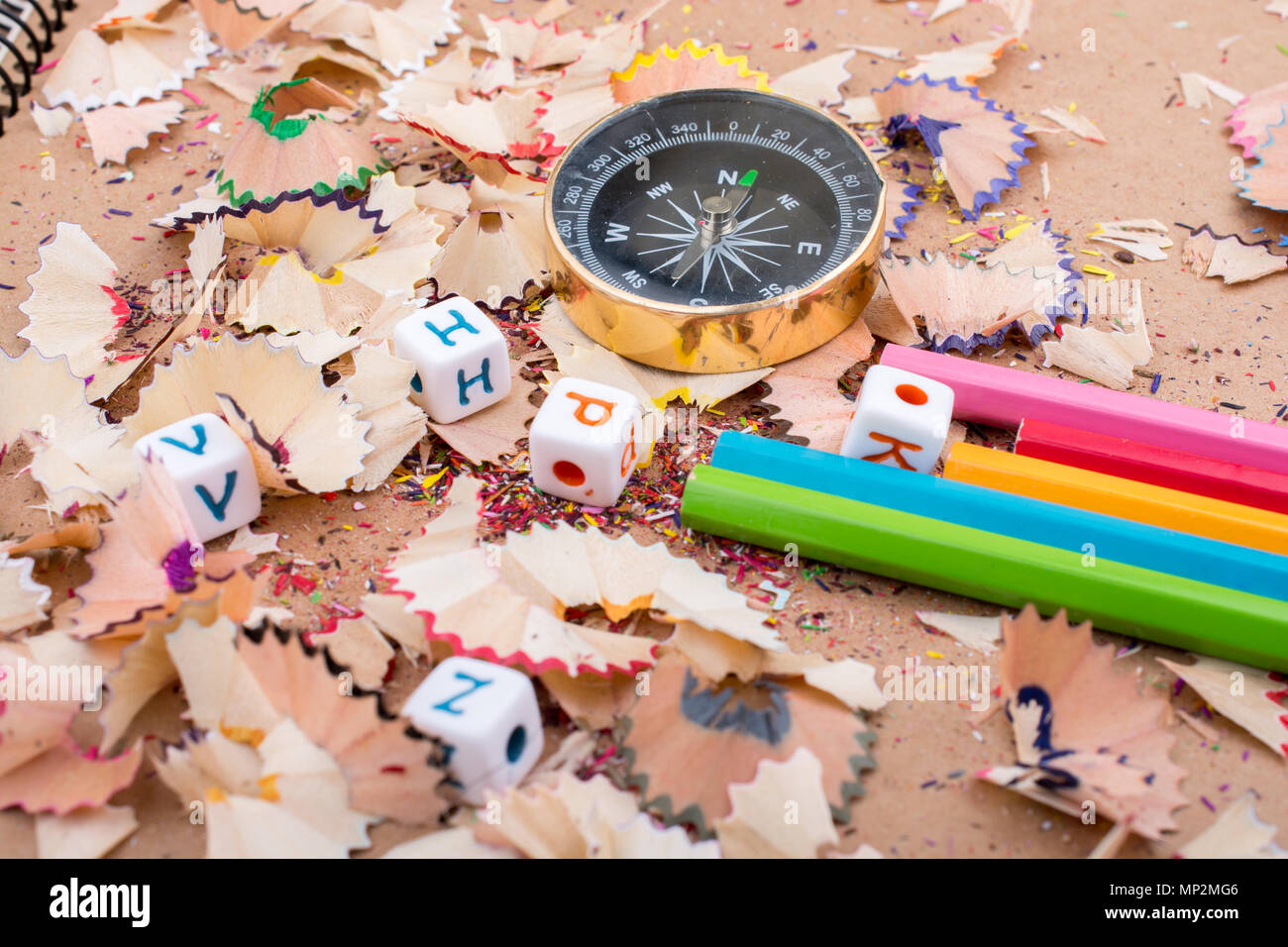 the compass instrument and a few colorful pencils Stock Photo - Alamy