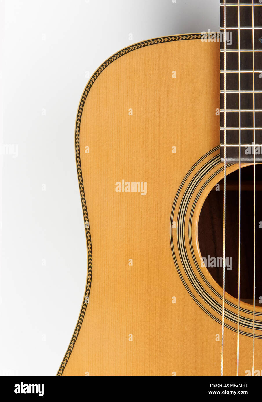a detail of an acoustic guitar in white background Stock Photo - Alamy