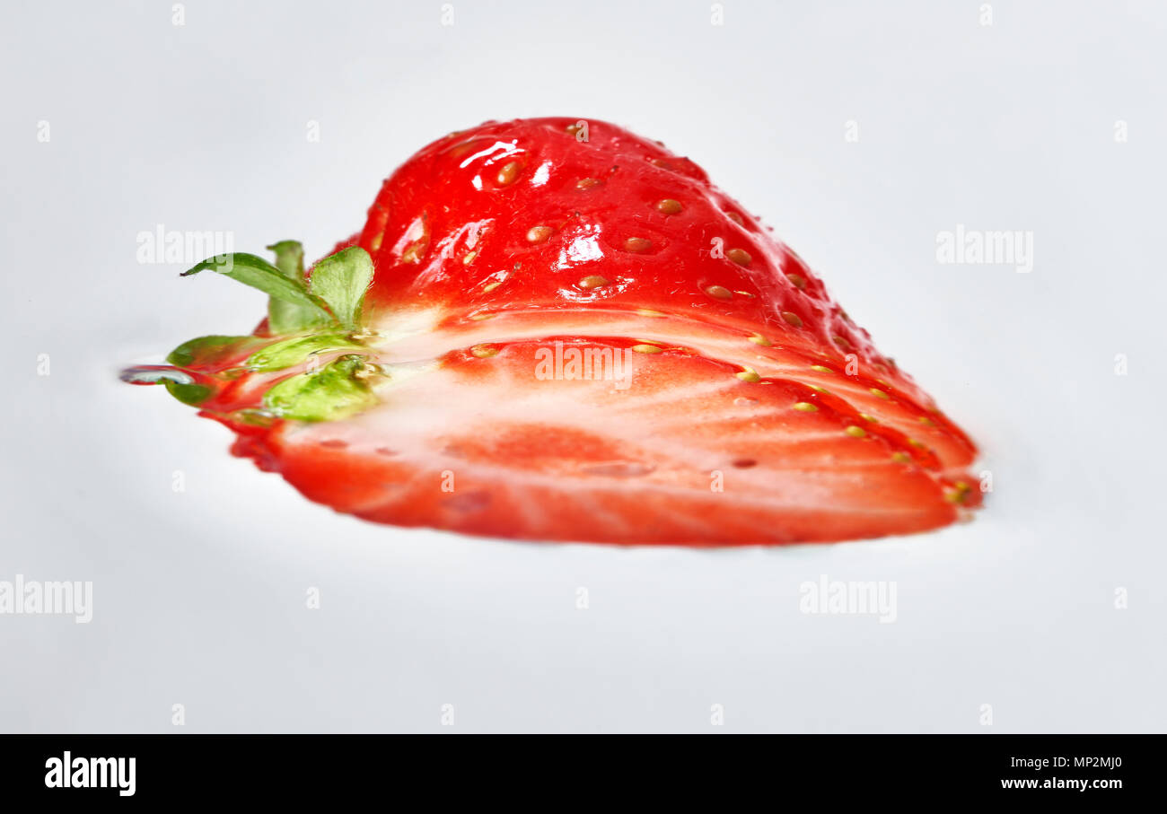 strawberry shot from below on white background Stock Photo - Alamy