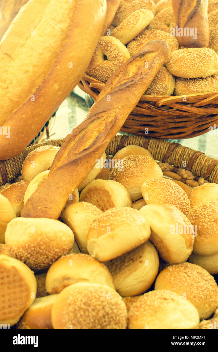 Lot of different bread. Arrangement of different breads at the bakery ...