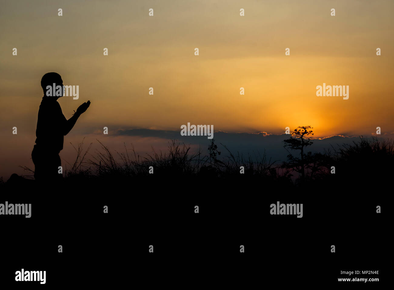 silhouette people praying and hope with sun shine Stock Photo - Alamy