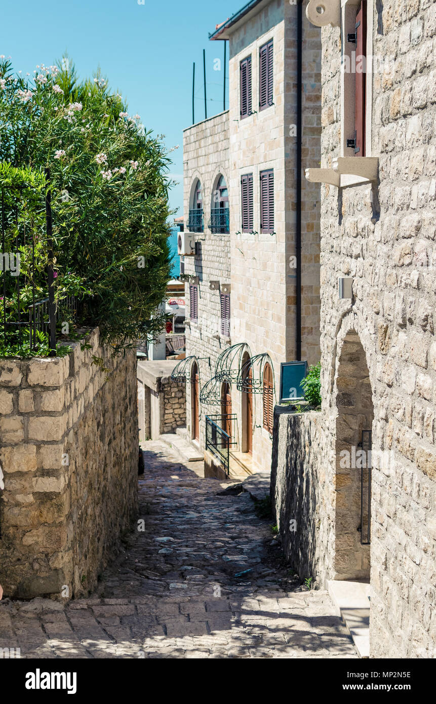 Old narrow street in Stari Grad of Ulcinj, Montenegro. The fortress in ...