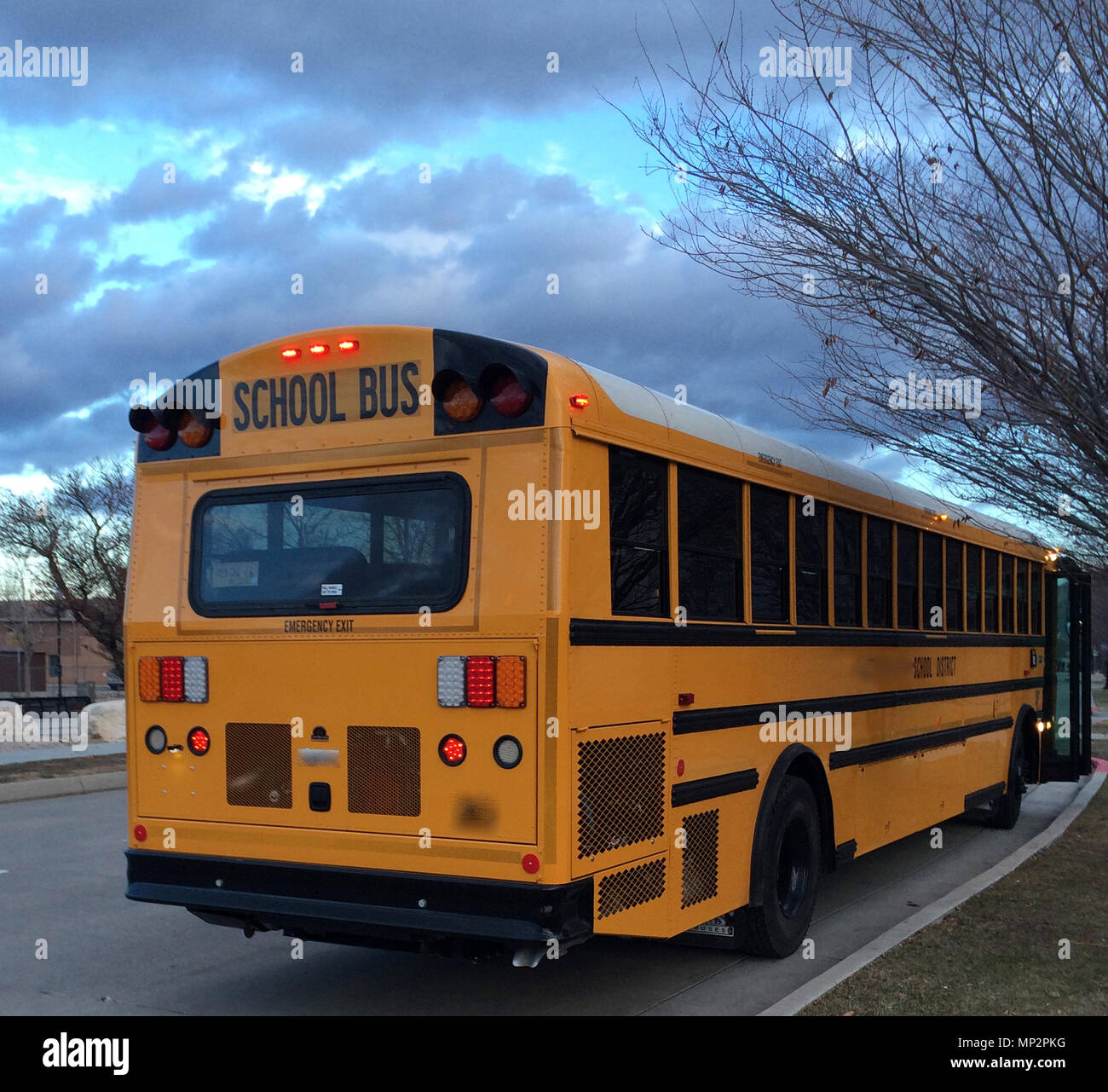 Early Morning Layover for School Bus with Partially Cloudy Sky ...