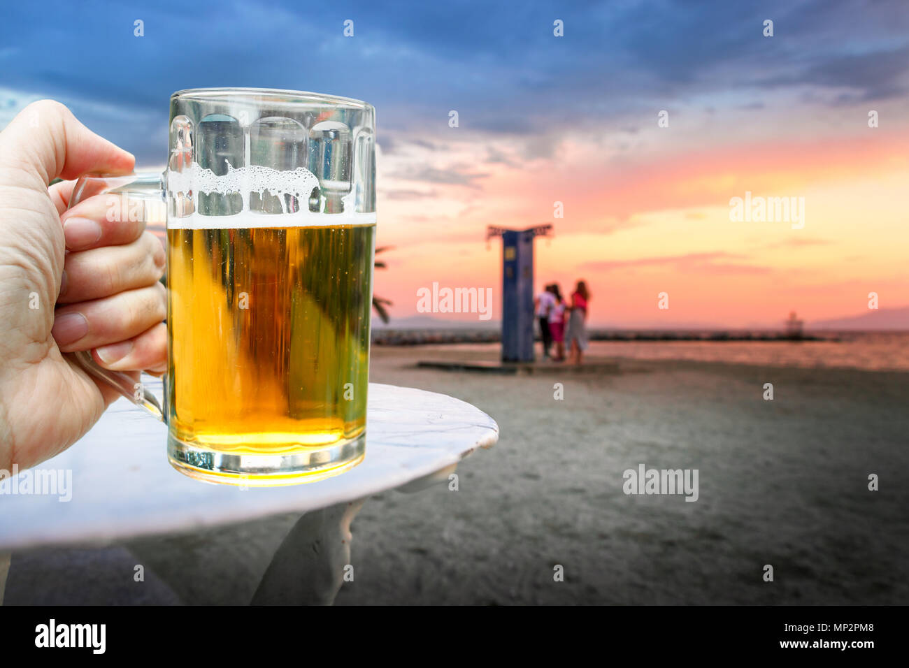 Hand holding glass beer hi-res stock photography and images - Alamy