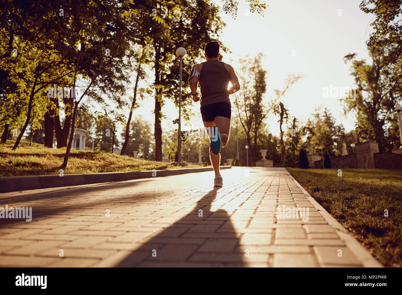Back view running man in hi-res stock photography and images - Alamy