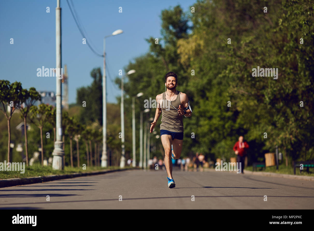 Male runner in park hi-res stock photography and images - Alamy